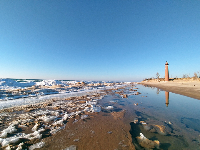 Sand, sky, and a tower of timeless charm. Little Sable Point is serving minimalist chic on the shores of Lake Michigan.