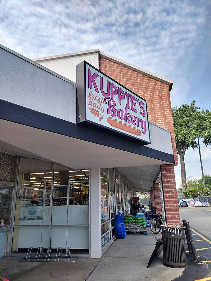 Welcome to donut heaven! Kuppie's Bakery beckons with its cheerful pink sign, promising a sugar-coated adventure that'll make your inner child squeal with delight.