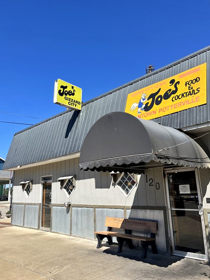 Welcome to gizzard paradise! Joe's Gizzard City stands proud, its cartoon rooster sign beckoning hungry adventurers to a world where deep-frying reigns supreme.