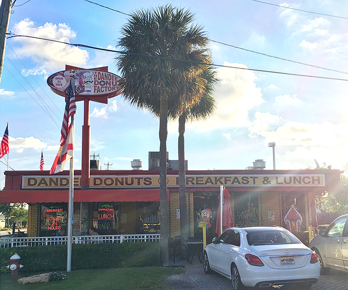 Welcome to donut paradise! Dandee Donut Factory's retro charm and swaying palms invite you to step back in time for a taste of sweet nostalgia.