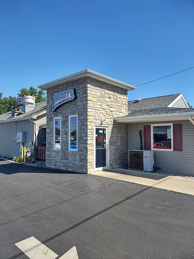Stone-cold stunner! Woody's Diner's rustic exterior is like a siren song for comfort food lovers, beckoning you with promises of culinary delights within.
