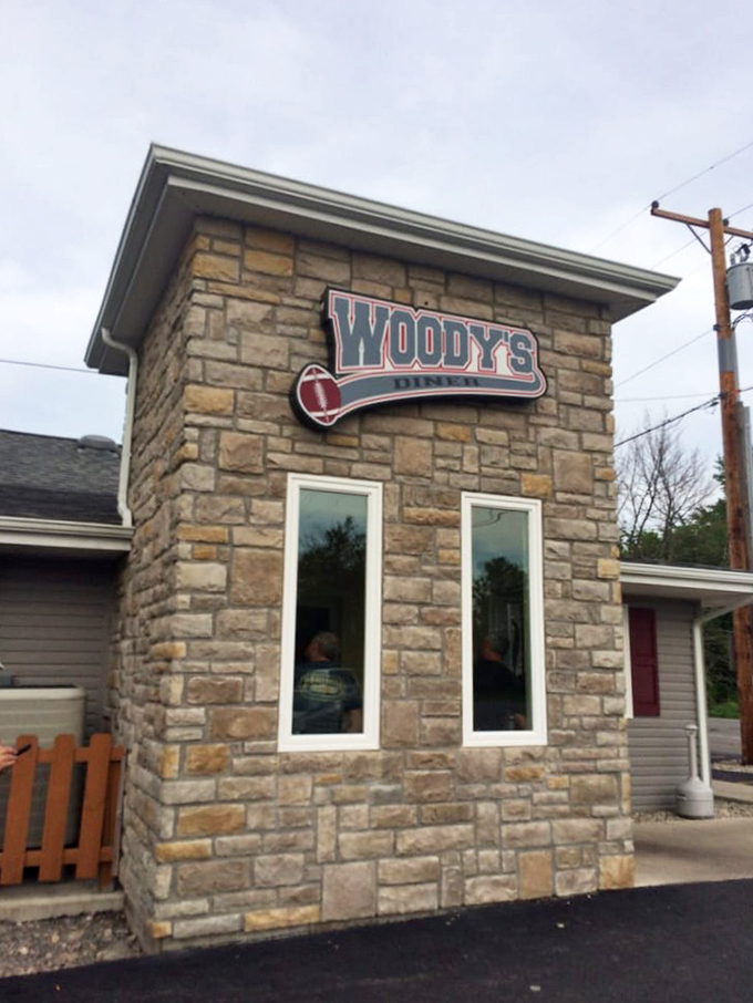Stone-cold stunner! Woody's Diner's rustic exterior is like a siren song for comfort food lovers, beckoning you with promises of culinary delights within.