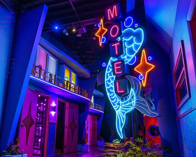 Neon dreams come alive! This dazzling sign isn't just a motel marker&mdash;it's a portal to a world where mermaids and stars collide in electric brilliance.