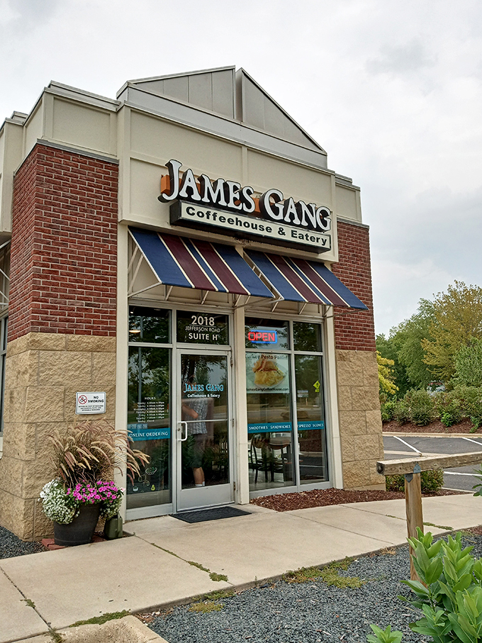 Welcome to sandwich paradise! James Gang's exterior promises a cozy retreat from the hustle and bustle, with its inviting awning and charming brick facade.