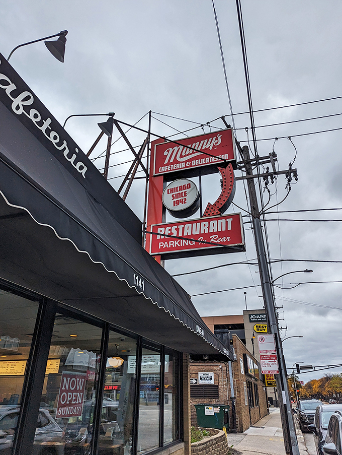 Neon dreams and deli schemes! Manny's iconic sign beckons like a lighthouse for the hungry, promising parking and paradise in one fell swoop.