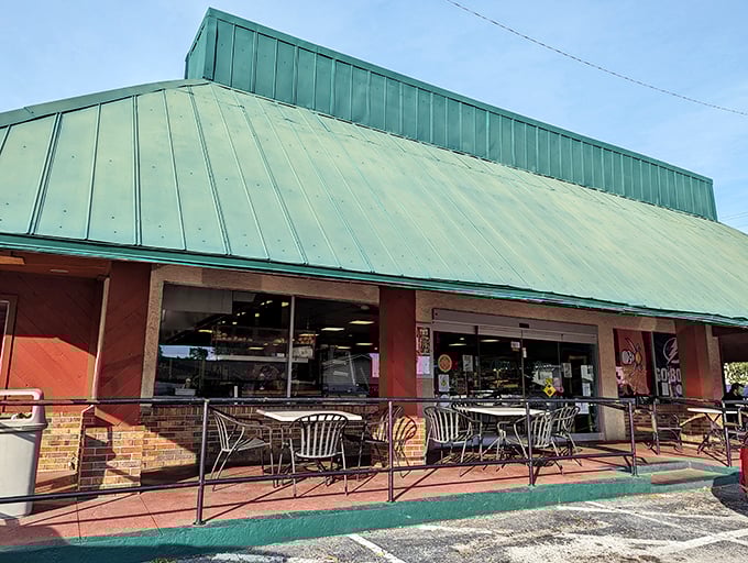 Welcome to carb heaven! Alessi Bakery's iconic green roof beckons like a beacon of buttery bliss, promising sweet salvation from the Florida heat.