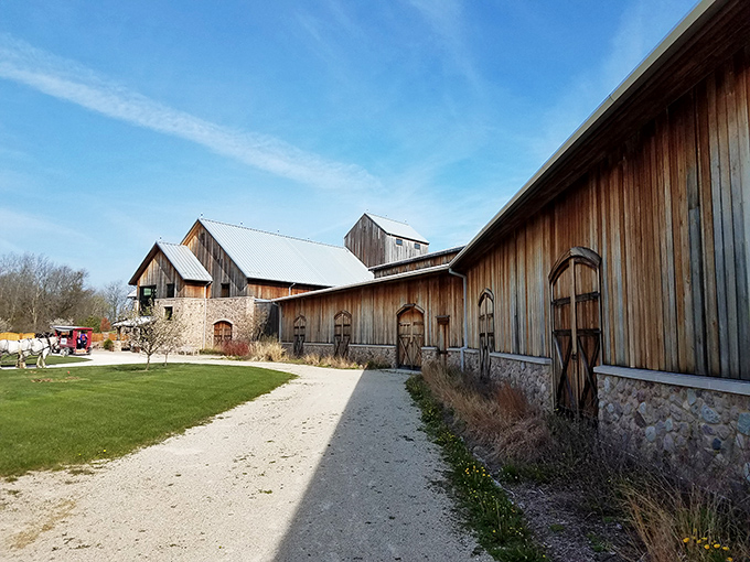 Rustic charm meets historical preservation at the Wade House's restored 19th-century buildings, where wooden barns and stone foundations stand as a testament to Wisconsin's pioneer past.