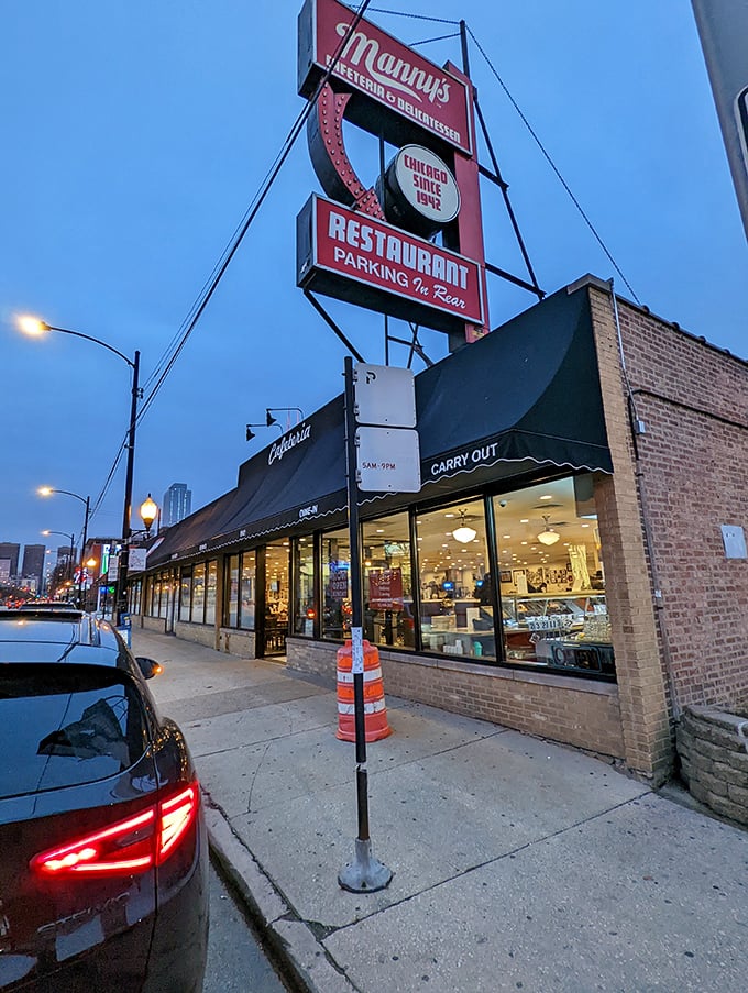 Neon dreams and deli schemes! Manny's iconic sign beckons like a lighthouse for the hungry, promising parking and paradise in one fell swoop.