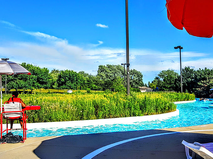 Welcome to aquatic paradise! Pelican Harbor's lazy river meanders through lush greenery, promising a refreshing escape from the Illinois heat.