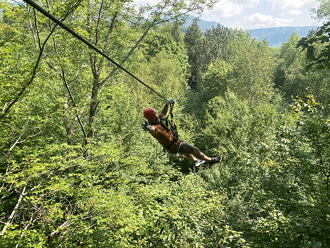 Leap of faith or leap of fun? At ArborTrek, it's both! This adventurer's graceful balancing act puts my couch-potato skills to shame.