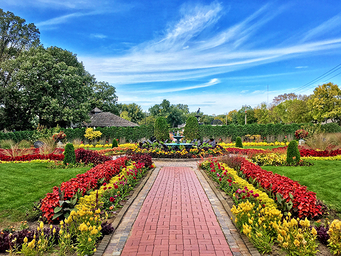 A red-brick path to paradise! This grand entrance to Munsinger Gardens promises a floral adventure that'll make your Instagram followers green with envy.