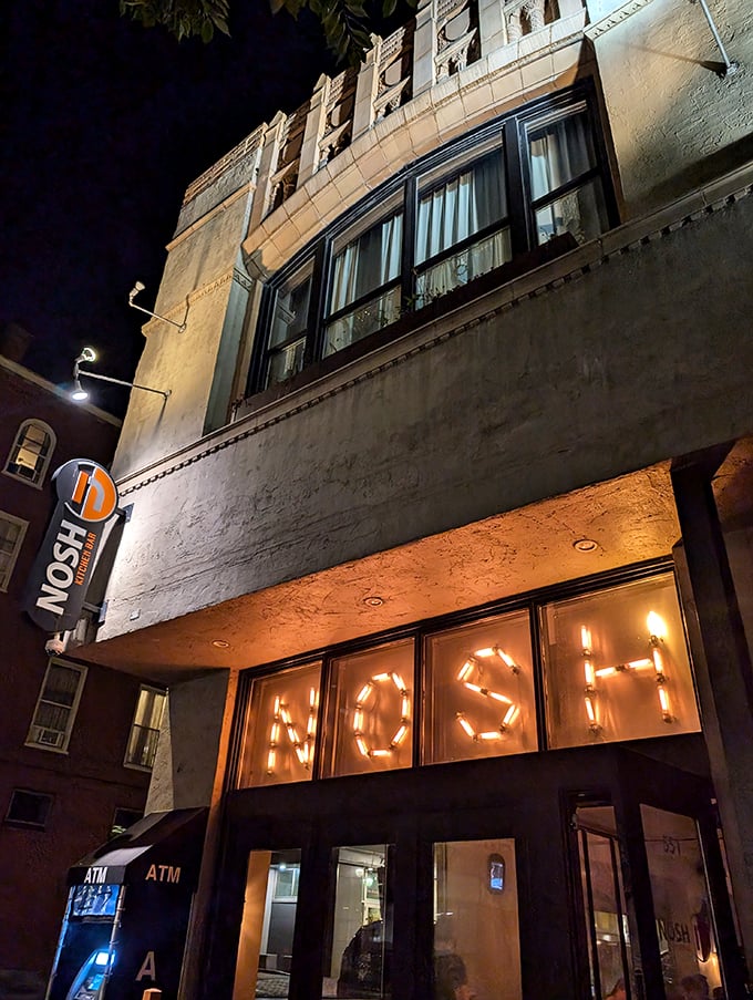 Nosh by night: Where comfort food dreams come true and calories don't count. This glowing beacon of culinary delight beckons to hungry souls like a moth to a flame.