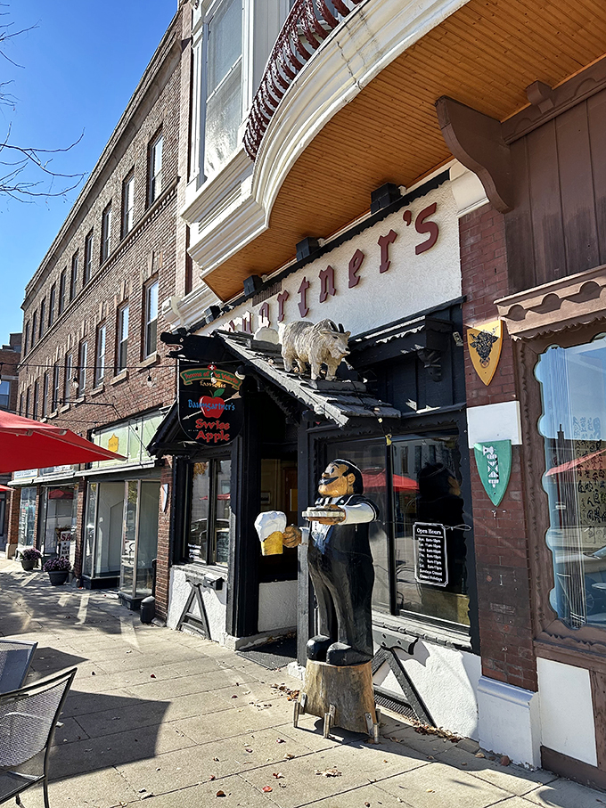 Welcome to cheese paradise! Baumgartner's facade is like a time machine, complete with a polar bear bouncer and a dapper beer-serving statue.
