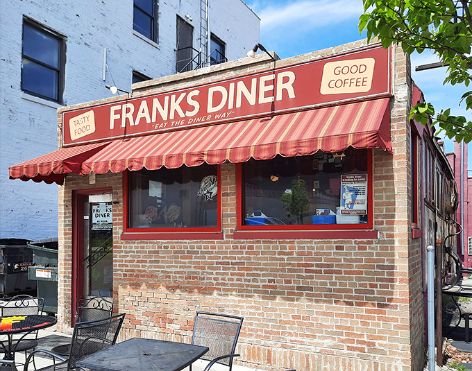 Step right up to Franks Diner, where the red awning promises "GOOD COFFEE" and the brick facade whispers tales of countless satisfied customers.