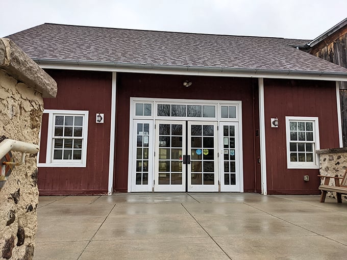 Rustic charm meets modern design: The welcoming entrance of the Wisconsin Museum of Quilts & Fiber Arts, housed in a beautifully restored barn-style building.