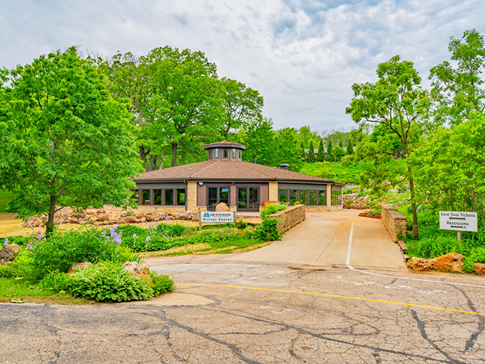 Welcome to Cave of the Mounds: Where nature's underground marvels meet lush green landscapes above.