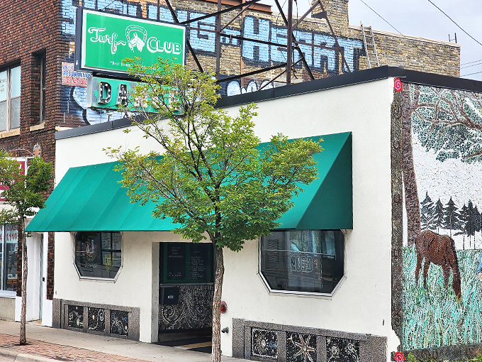 Rock 'n' roll history meets small-town charm! The Turf Club's iconic green sign beckons music lovers like a siren song, promising unforgettable nights and legendary tunes.