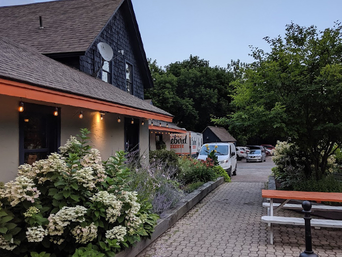 Welcome to barbecue heaven! Bluebird's charming exterior promises smoky delights within, nestled among Vermont's lush greenery.