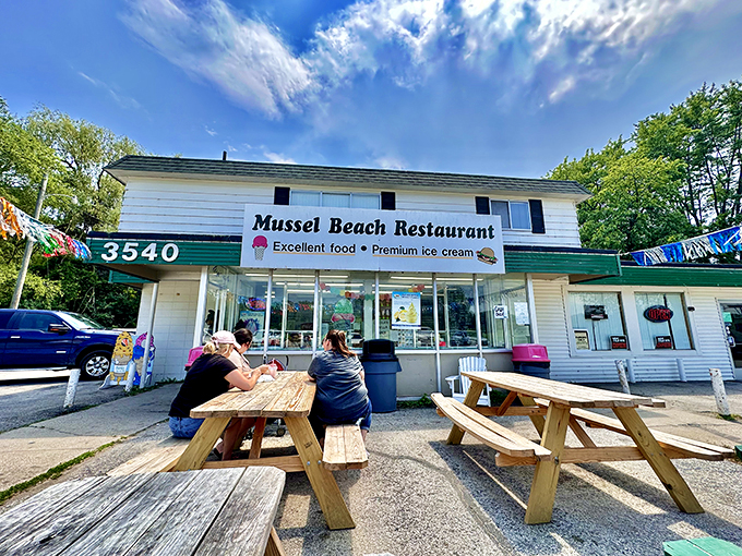 Welcome to flavor town! Mussell Beach Drive-In stands proud, a beacon of nostalgia and mouthwatering delights in Bay City.