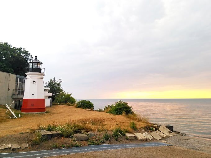 "Ahoy, landlubbers! This pint-sized beacon stands tall against Lake Erie's vastness, proving that sometimes the best things come in small, striped packages."