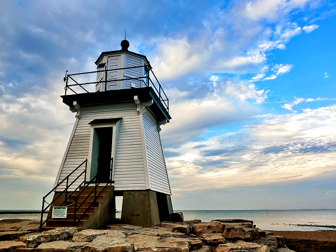 Beacon of beauty! This charming lighthouse stands tall against the sky, like a maritime supermodel ready for its close-up.