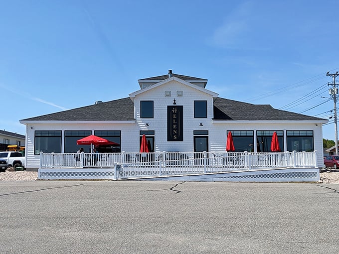 A slice of New England heaven! Helen's Restaurant stands proud, its white clapboard exterior and red umbrellas beckoning like a lighthouse for hungry souls.
