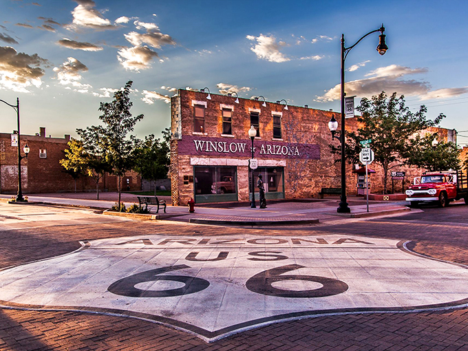 Standin' on the Corner in Winslow, Arizona: Where Route 66 meets Eagles nostalgia in a picture-perfect sunset scene.
