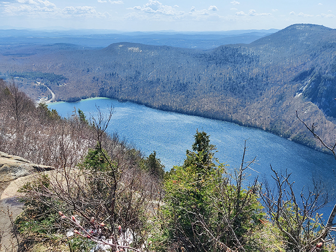 Nature's masterpiece unfolds: Lake Willoughby nestled between mountains, a sight that'll make you forget your smartphone exists.