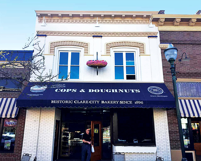 A blue awning beckons like a siren's call, promising sweet delights within. This historic bakery's facade is as inviting as the aroma of fresh donuts wafting through the air