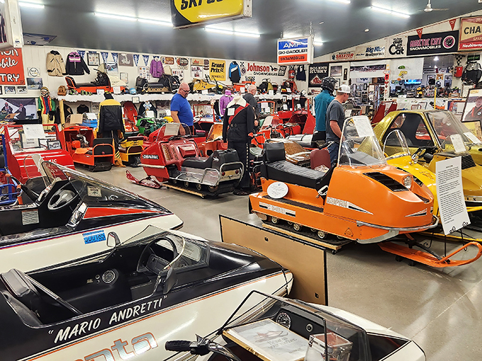 A rainbow of retro rides! This snowmobile wonderland is like stepping into a Willy Wonka factory for winter enthusiasts.