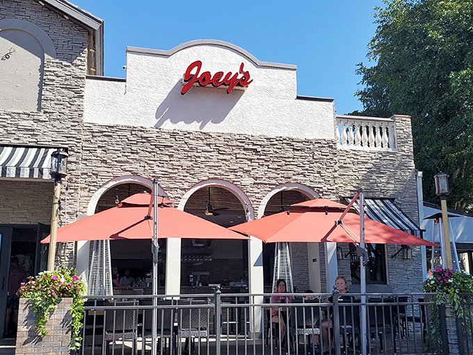 Welcome to Joey's, where the exterior is as inviting as a warm Italian hug. This stone facade and red awning combo is practically shouting "Mangia!" at passersby.