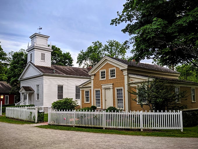 Step into a Norman Rockwell painting come to life! This pristine white church stands proudly, surrounded by vibrant flowers and picket fences &ndash; a slice of Americana that'll make you want to belt out "God Bless America."