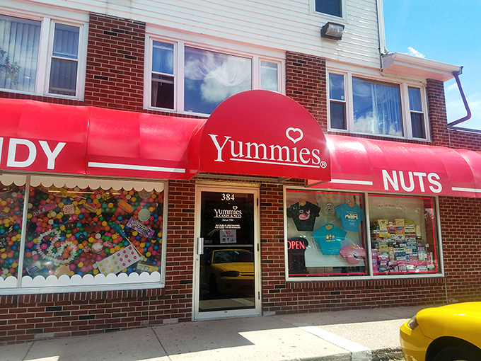 A candy lover's dream come true! Yummies Candy & Nuts beckons with its vibrant red awning, promising a sweet escape from the everyday grind.