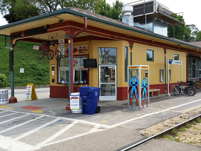 All aboard the flavor express! This sunny yellow station isn't just a relic—it's your ticket to pizza paradise.