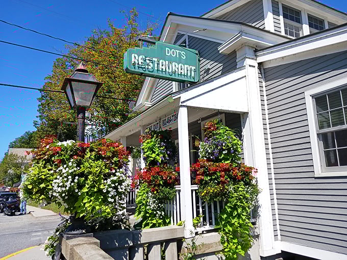 Welcome to Dot's, where nostalgia blooms alongside the flowers! This charming exterior promises a feast for both your eyes and your taste buds.