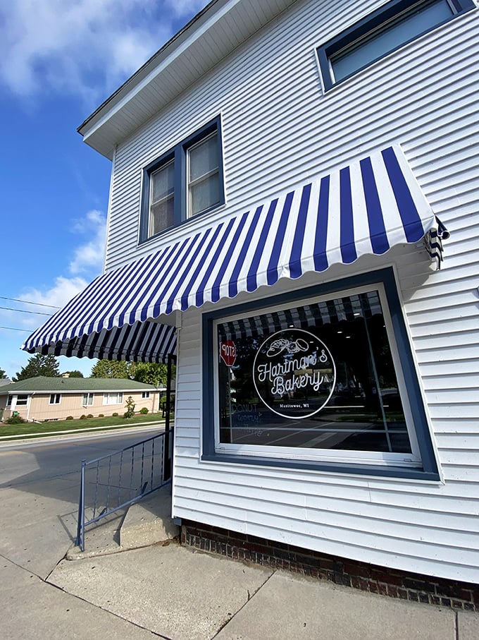 A slice of Americana with a side of sugar! Hartman's Bakery's charming exterior promises sweet delights within, like a real-life Willy Wonka factory in small-town Wisconsin.