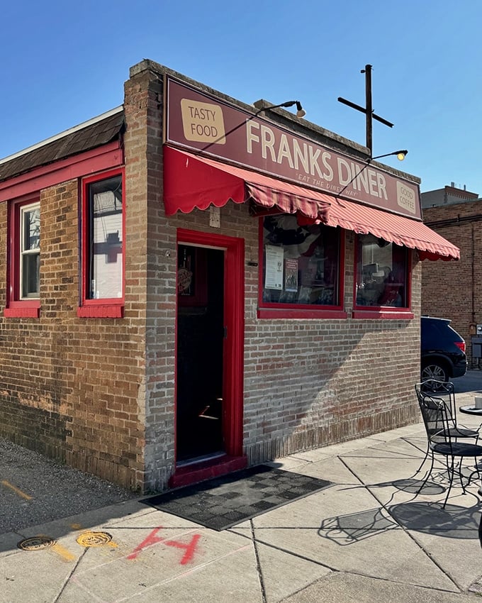 Step right up to Franks Diner, where the red awning promises "GOOD COFFEE" and the brick facade whispers tales of countless satisfied customers.