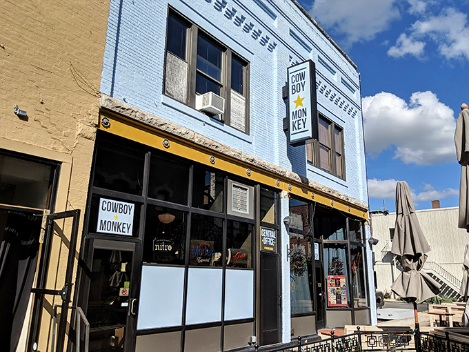 A splash of sky blue in downtown Champaign! Cowboy Monkey's exterior is like a cheerful wink amidst the urban landscape.