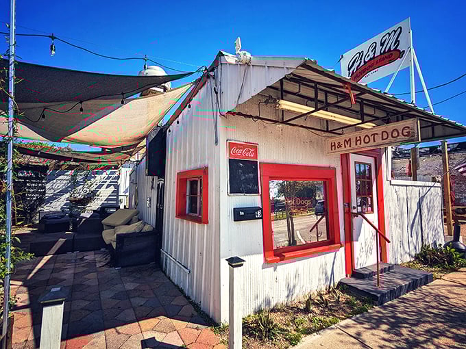 Step right up to hot dog heaven! This charming white shack with its bold red trim is like a beacon for hungry souls in Defuniak Springs.