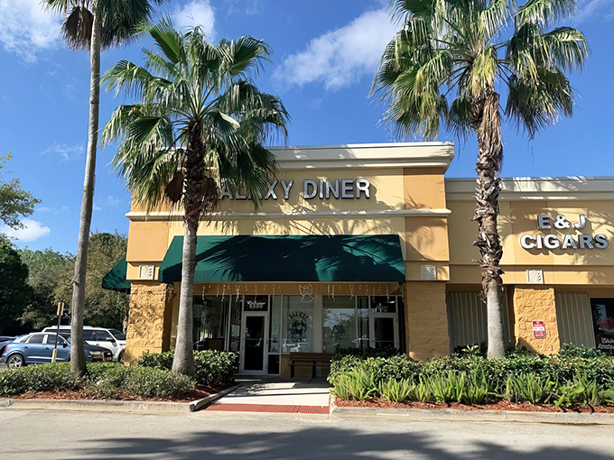 Palm trees and sunshine: Galaxy Diner's exterior promises a cosmic collision of comfort food and coastal charm.