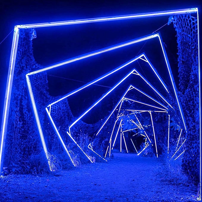 Step into a neon dreamscape! This luminous tunnel feels like you've stumbled into Tron's backyard, minus the digital bad guys.