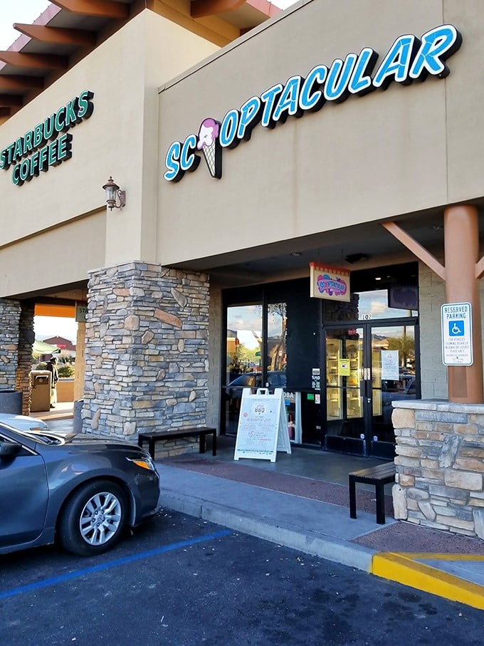 Welcome to flavor paradise! Scooptacular's vibrant sign promises a world of frozen delights, nestled next to everyone's favorite caffeine dealer.