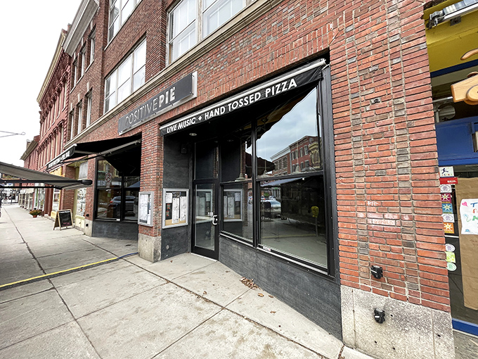 Brick and mortar never looked so inviting! Positive Pie's storefront promises hand-tossed pizza and live music &ndash; a feast for all senses.