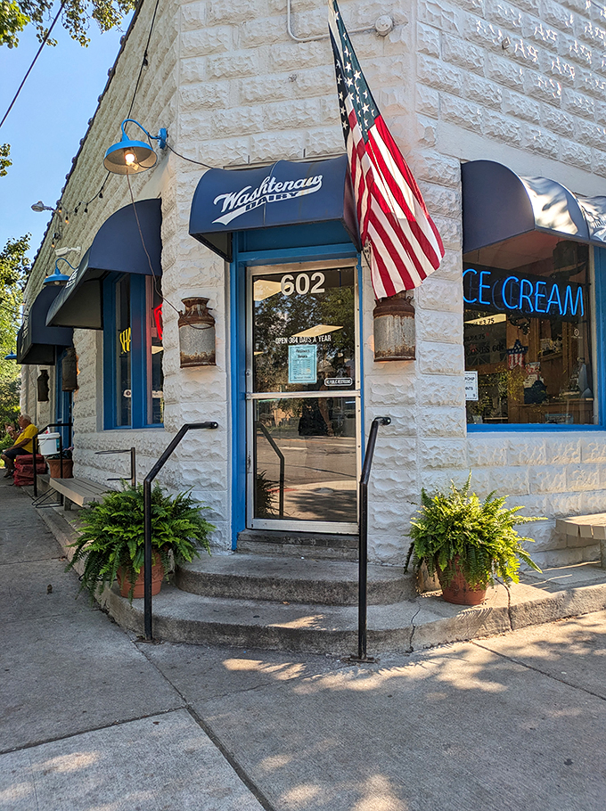 A slice of Americana with a cherry on top! Washtenaw Dairy's charming exterior beckons like a siren song of sweetness, complete with twinkling lights and inviting benches.