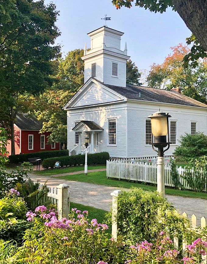 Step into a Norman Rockwell painting come to life! This pristine white church stands proudly, surrounded by vibrant flowers and picket fences – a slice of Americana that'll make you want to belt out "God Bless America."