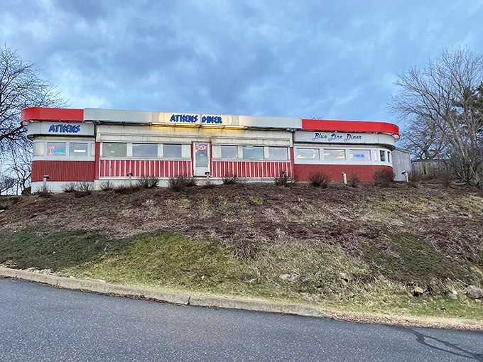 A slice of Americana with a Greek twist! Athens Diner stands proud, its red-trimmed exterior beckoning hungry travelers like a lighthouse for empty stomachs.