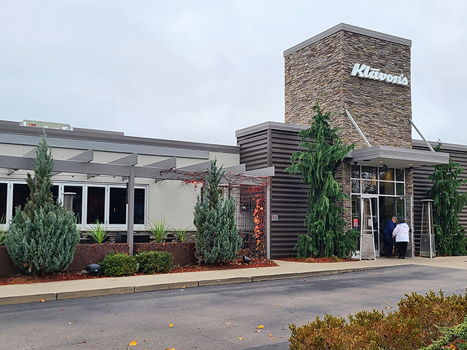 Welcome to Klavon's, where the exterior is as inviting as a warm hug from your favorite aunt. This modern stone facade promises a cozy retreat for pizza lovers and sports enthusiasts alike.