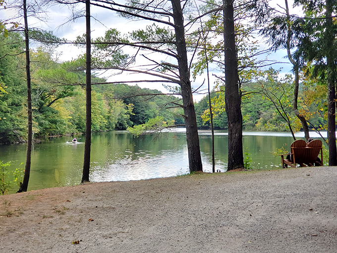 Nature's own infinity pool! Emerald Lake stretches out like a mirror, reflecting the Green Mountains in a display that would make Bob Ross weep with joy.