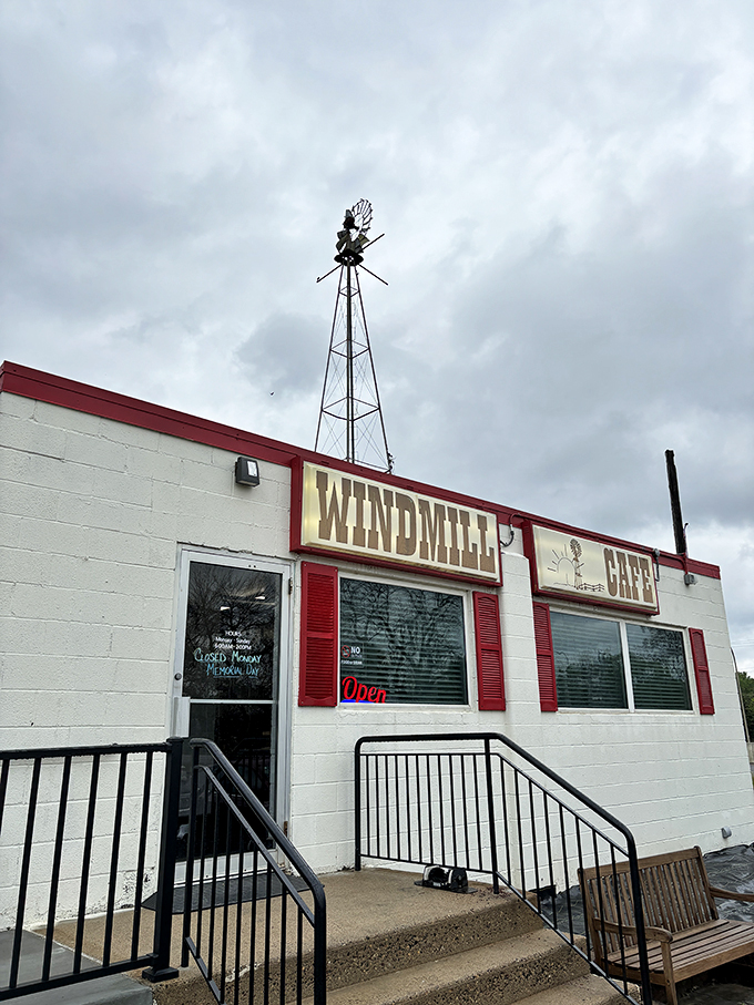 Welcome to the Windmill Cafe, where nostalgia meets appetite! This charming exterior promises a journey back to simpler times, complete with comfort food that'll make your taste buds sing.