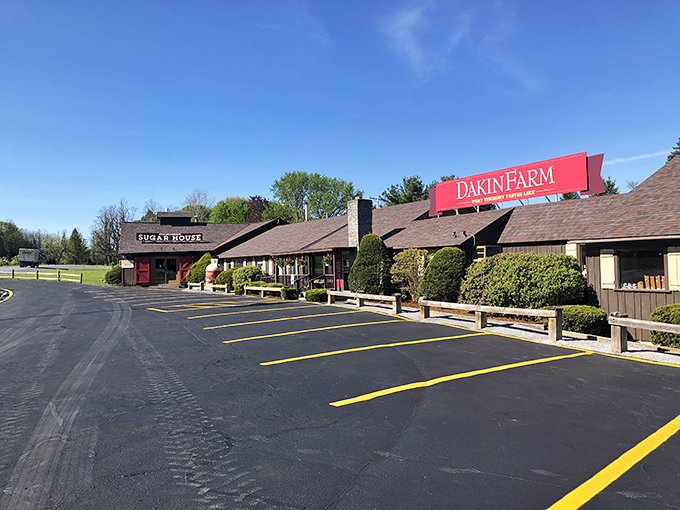 Welcome to flavor paradise! Dakin Farm's charming exterior promises a journey through Vermont's tastiest treasures. It's like Willy Wonka's factory, but with more maple and less singing.